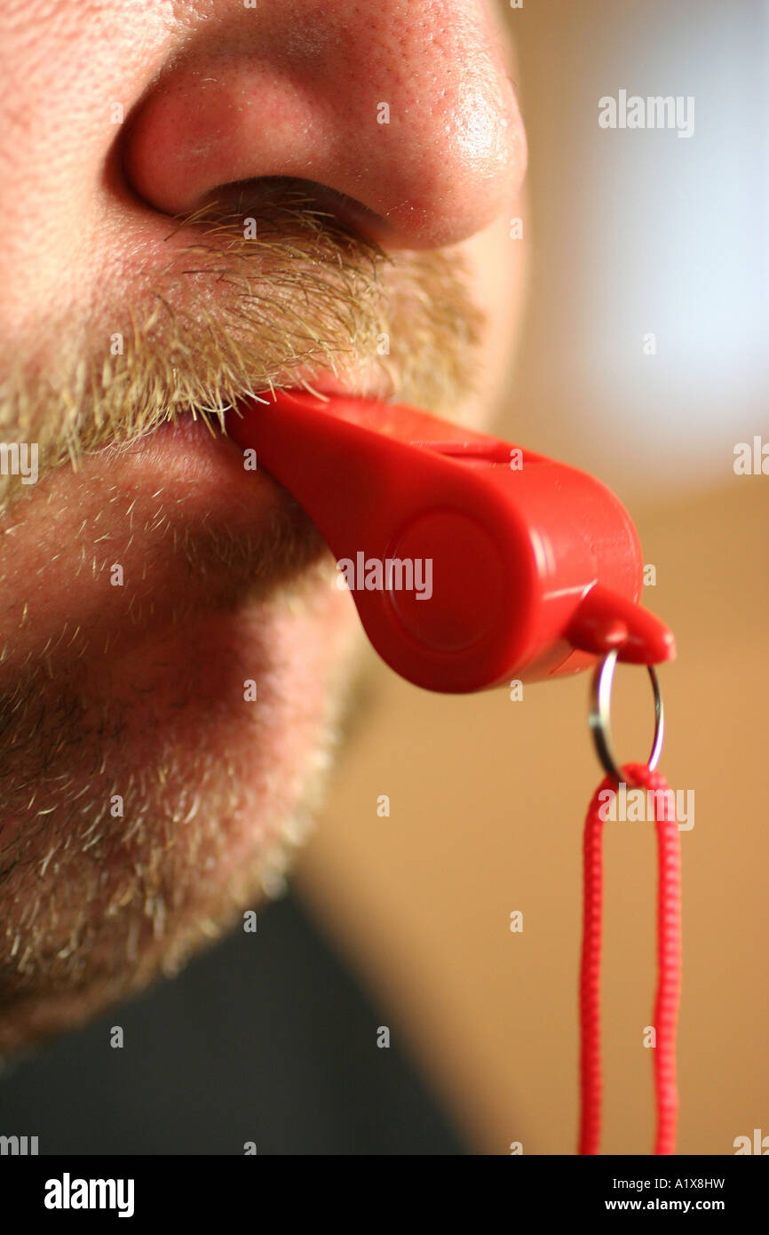 man with a red whistle Stock Photo - Alamy