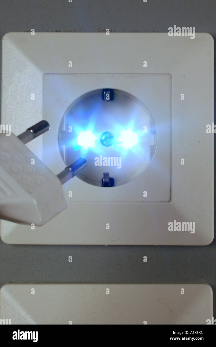 socket under current Stock Photo - Alamy