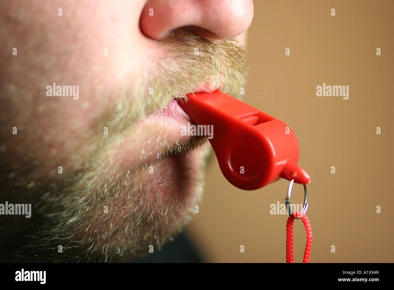 man with a red whistle Stock Photo - Alamy
