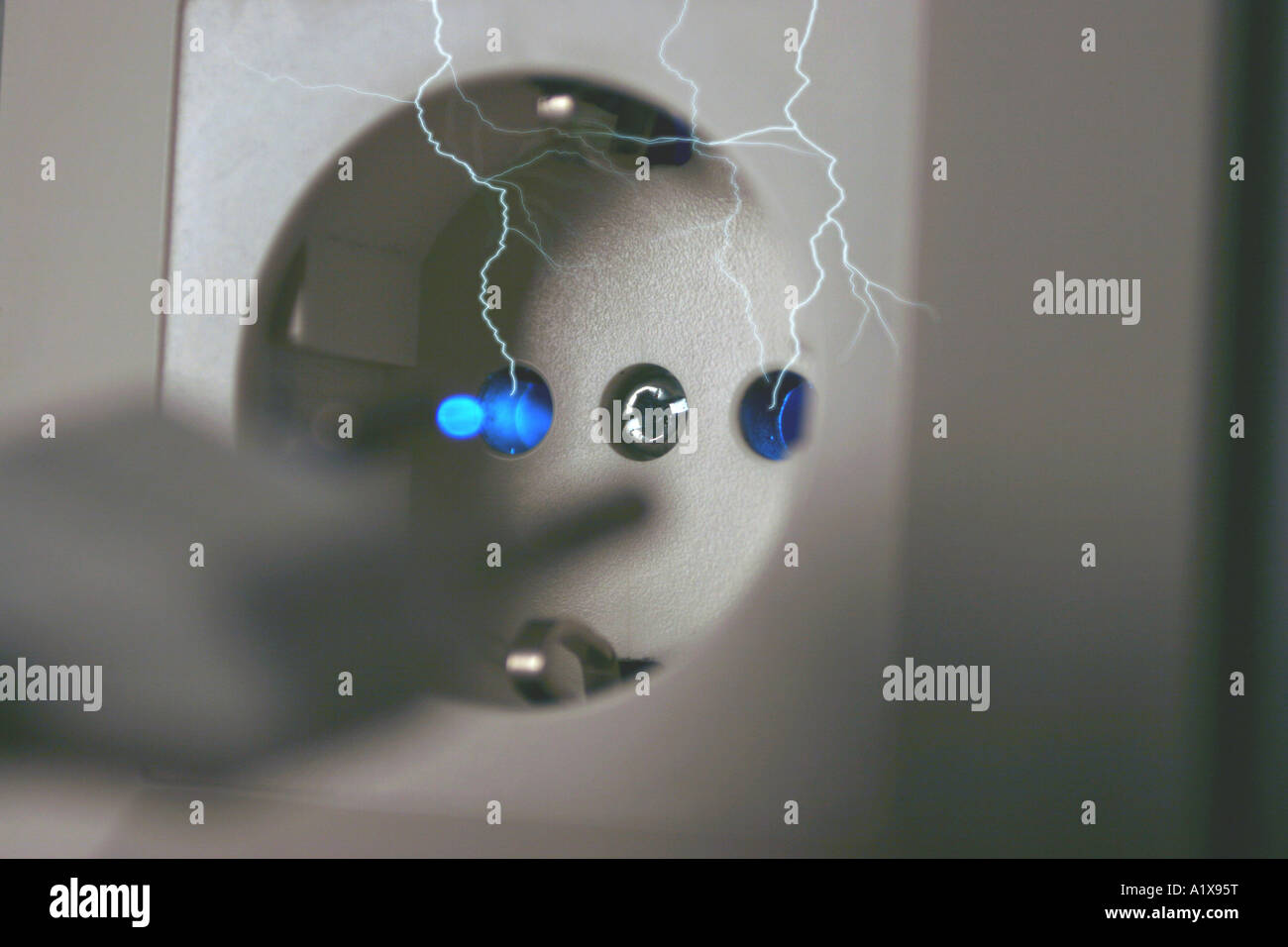 socket under current Stock Photo - Alamy