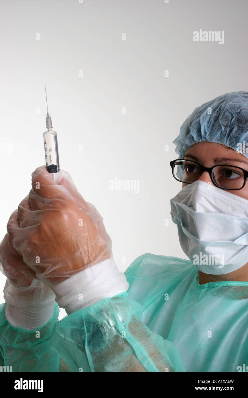 surgeon with an injection Stock Photo - Alamy
