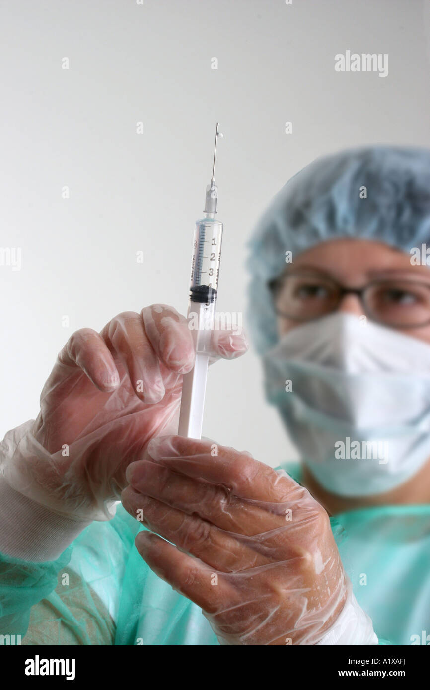 surgeon with an injection Stock Photo - Alamy