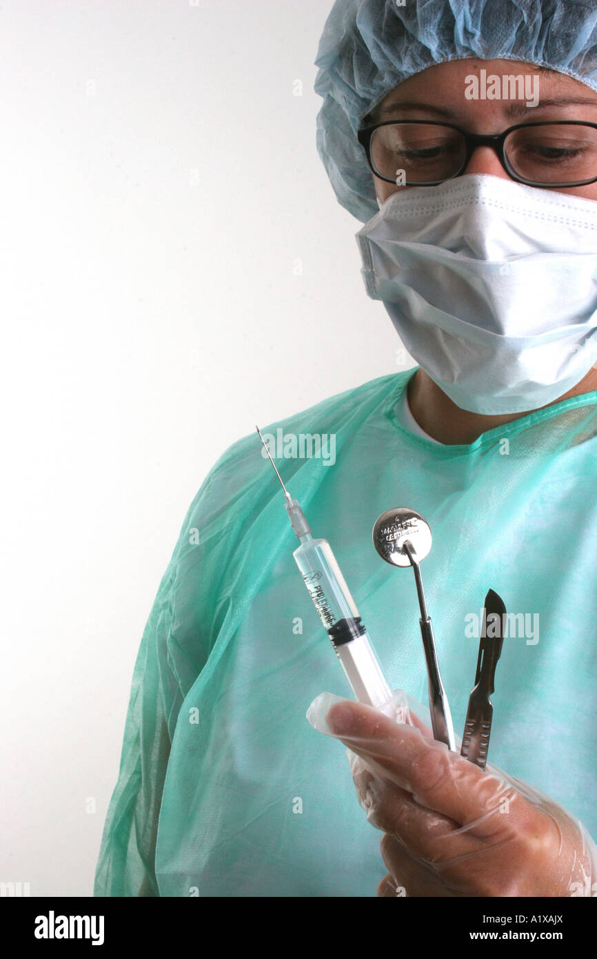 surgeion with a scalpel and an injection Stock Photo - Alamy