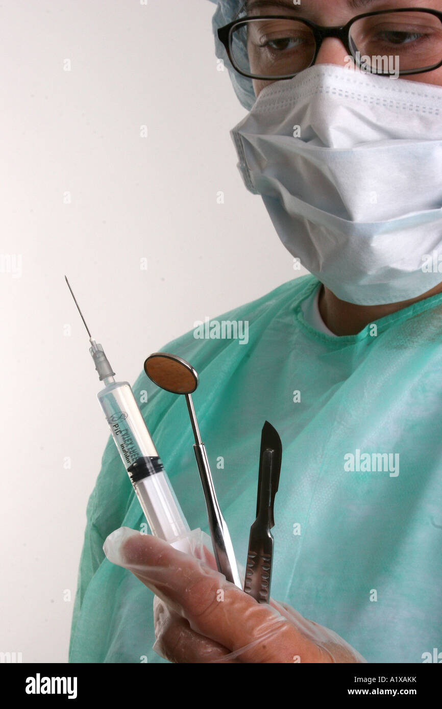 surgeion with a scalpel and an injection Stock Photo - Alamy