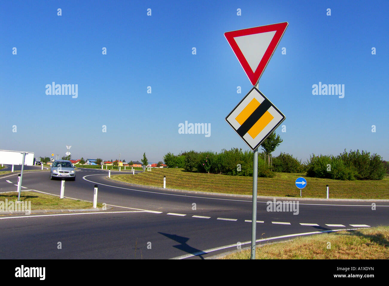 Yield roundabout traffic signs hi-res stock photography and images - Alamy