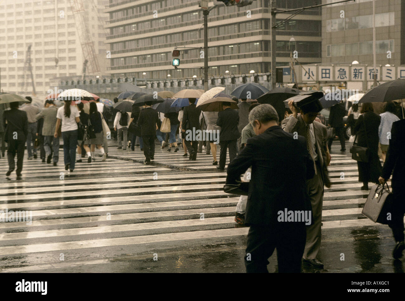 JAPAN TOKYO WET SUMMER WEATHER SHINJUKU STATION AREA Stock Photo - Alamy