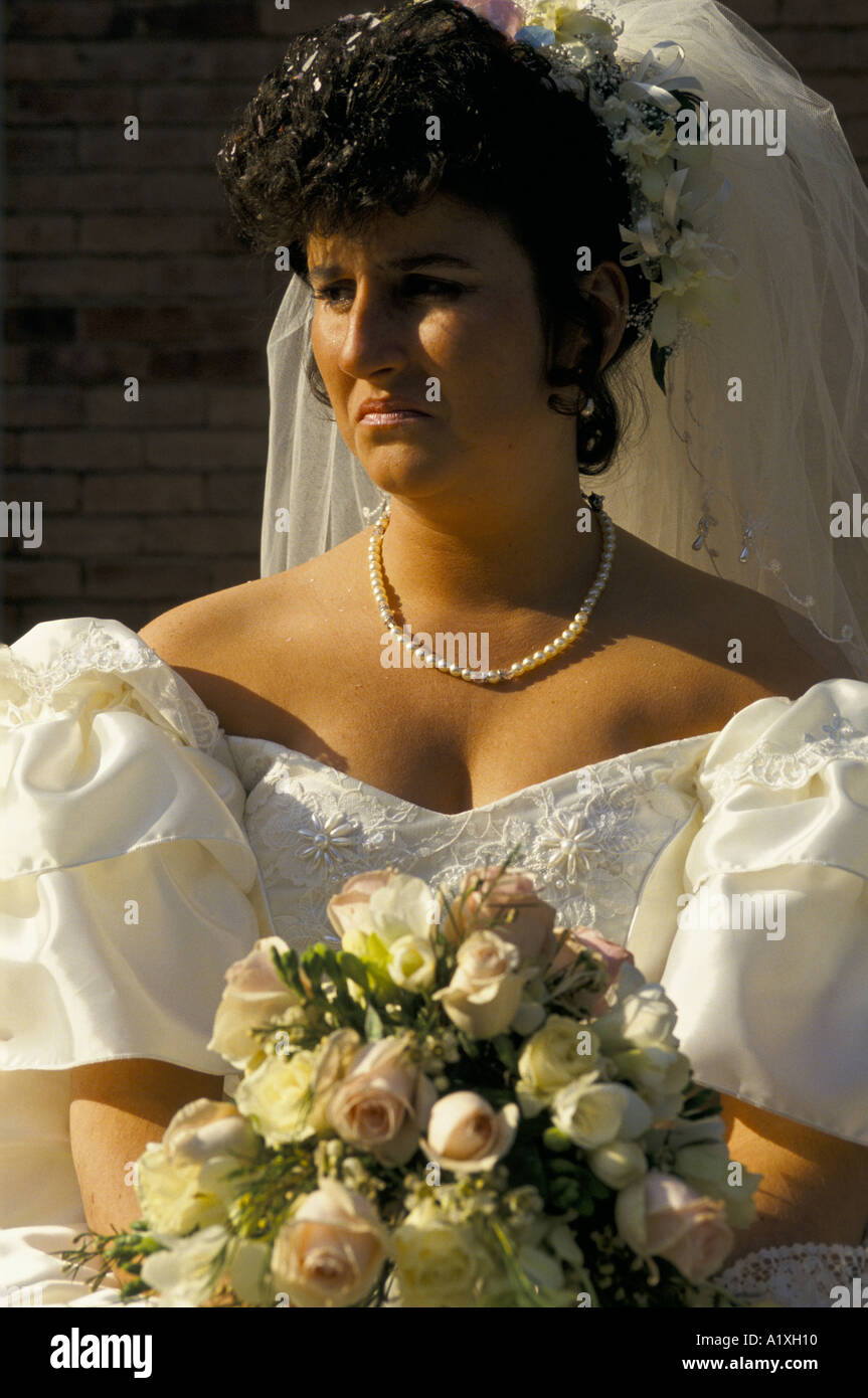 BRIDE WITH SAD EXPRESSION ON HER FACE AT THE WEDDING OF MARSHA GODWIN ...