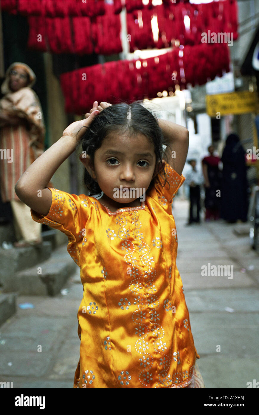 Pretty Hindu Girl wearing gold dress Stock Photo - Alamy