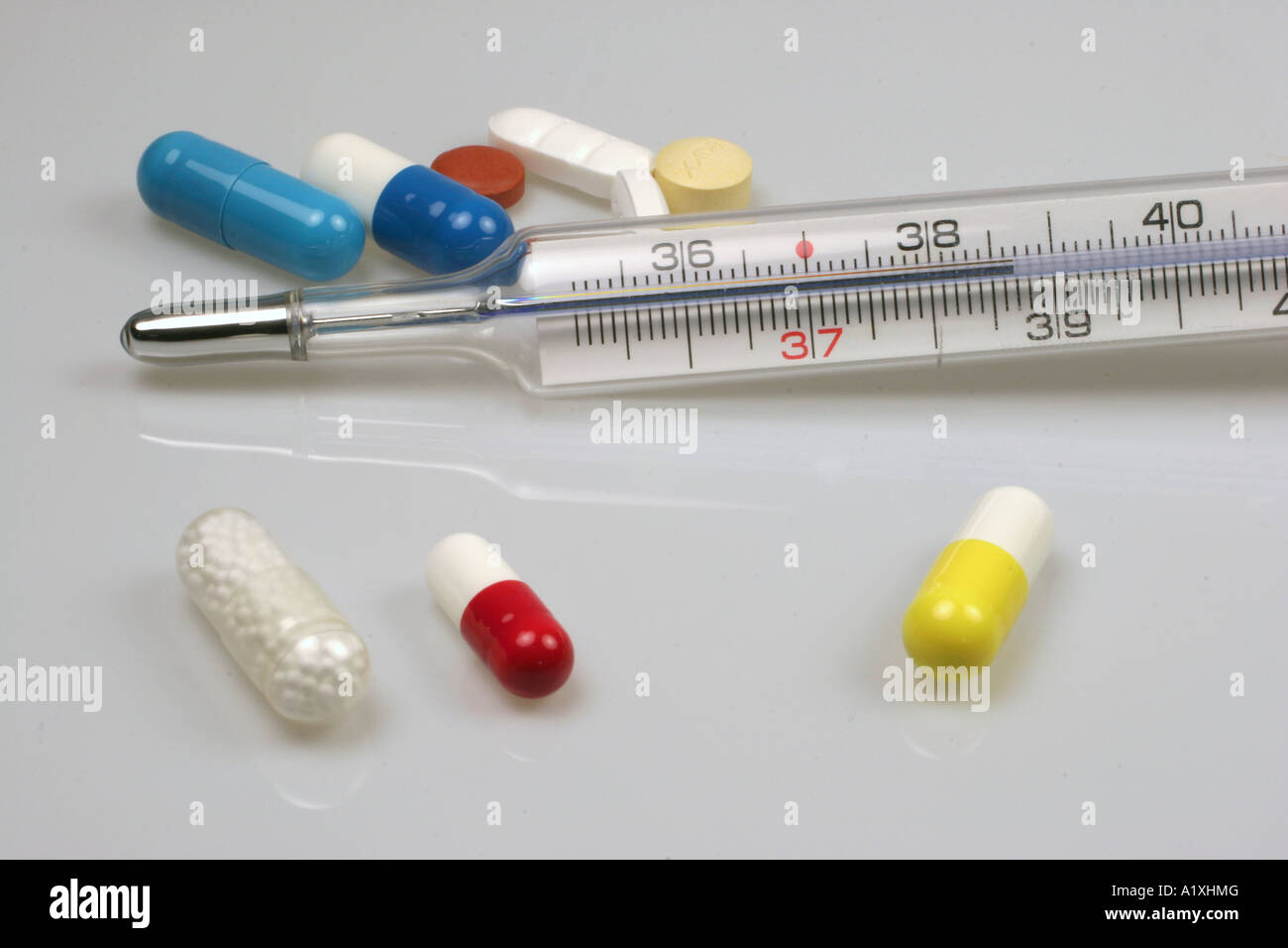 tablets and a clinical thermometer Stock Photo - Alamy