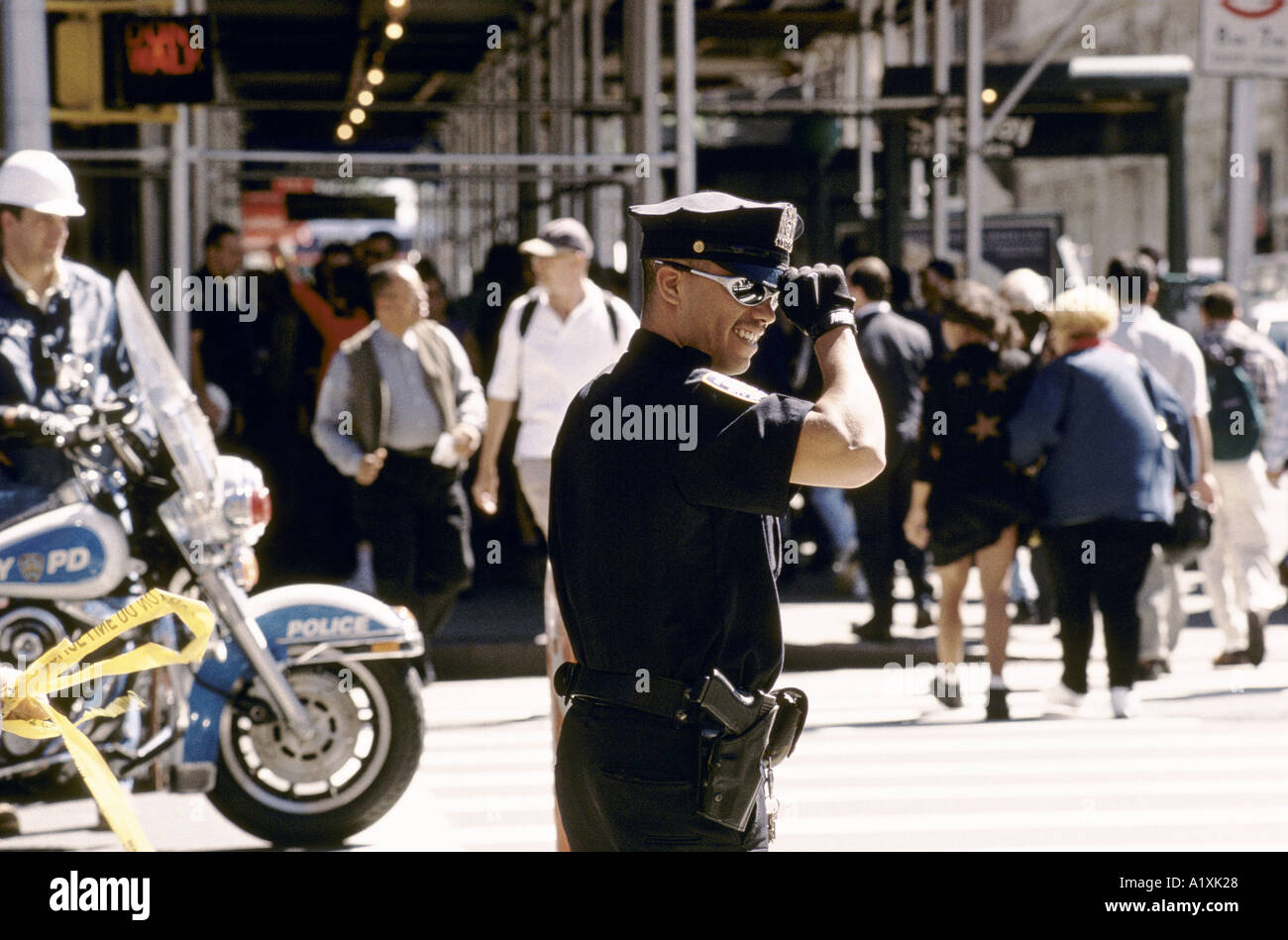 NEW YORK CITY USA TRAFFIC POLICEMAN IN MIDTOWN MANHATTEN GIVES A ...