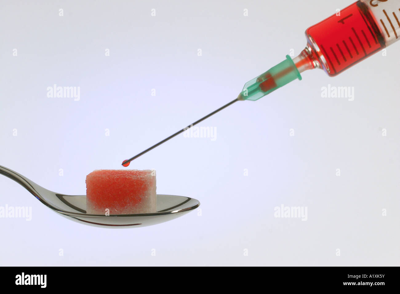 sugar cube and a injection Stock Photo - Alamy