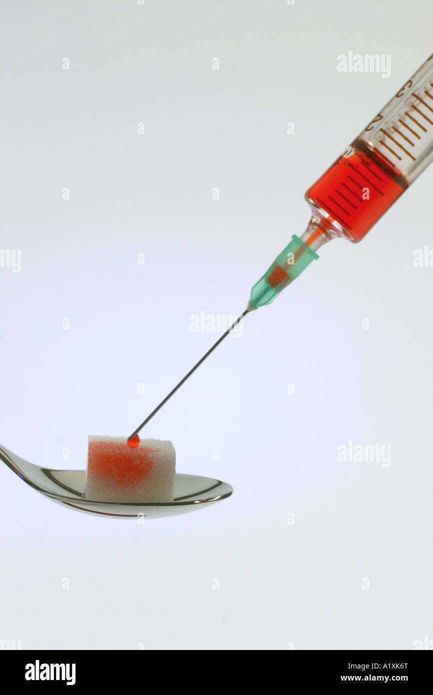 sugar cube and a injection Stock Photo - Alamy