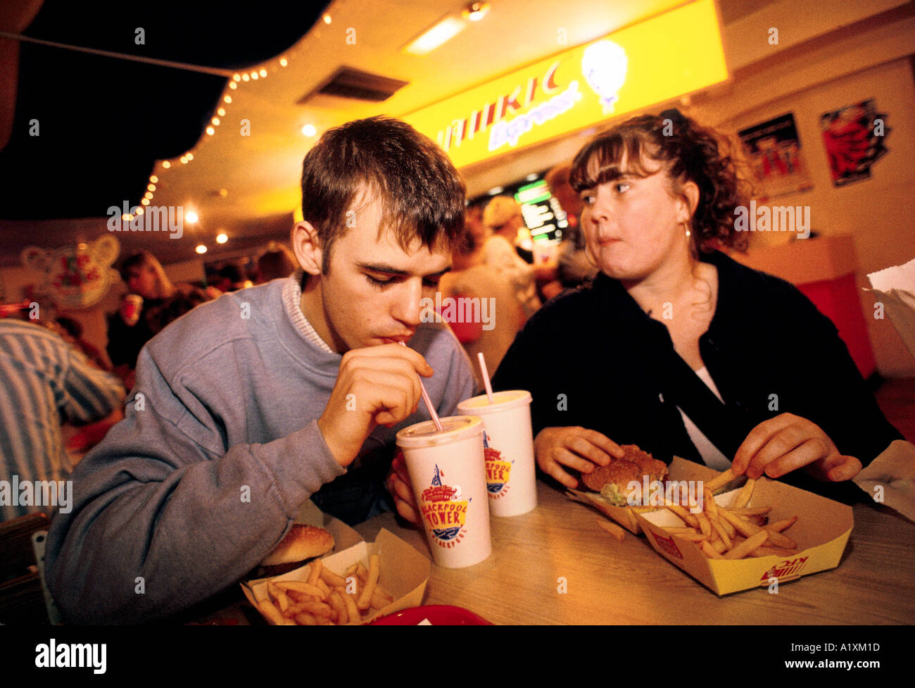 EATING FAST FOOD IN BLACKPOOL TOWER KFC Stock Photo - Alamy