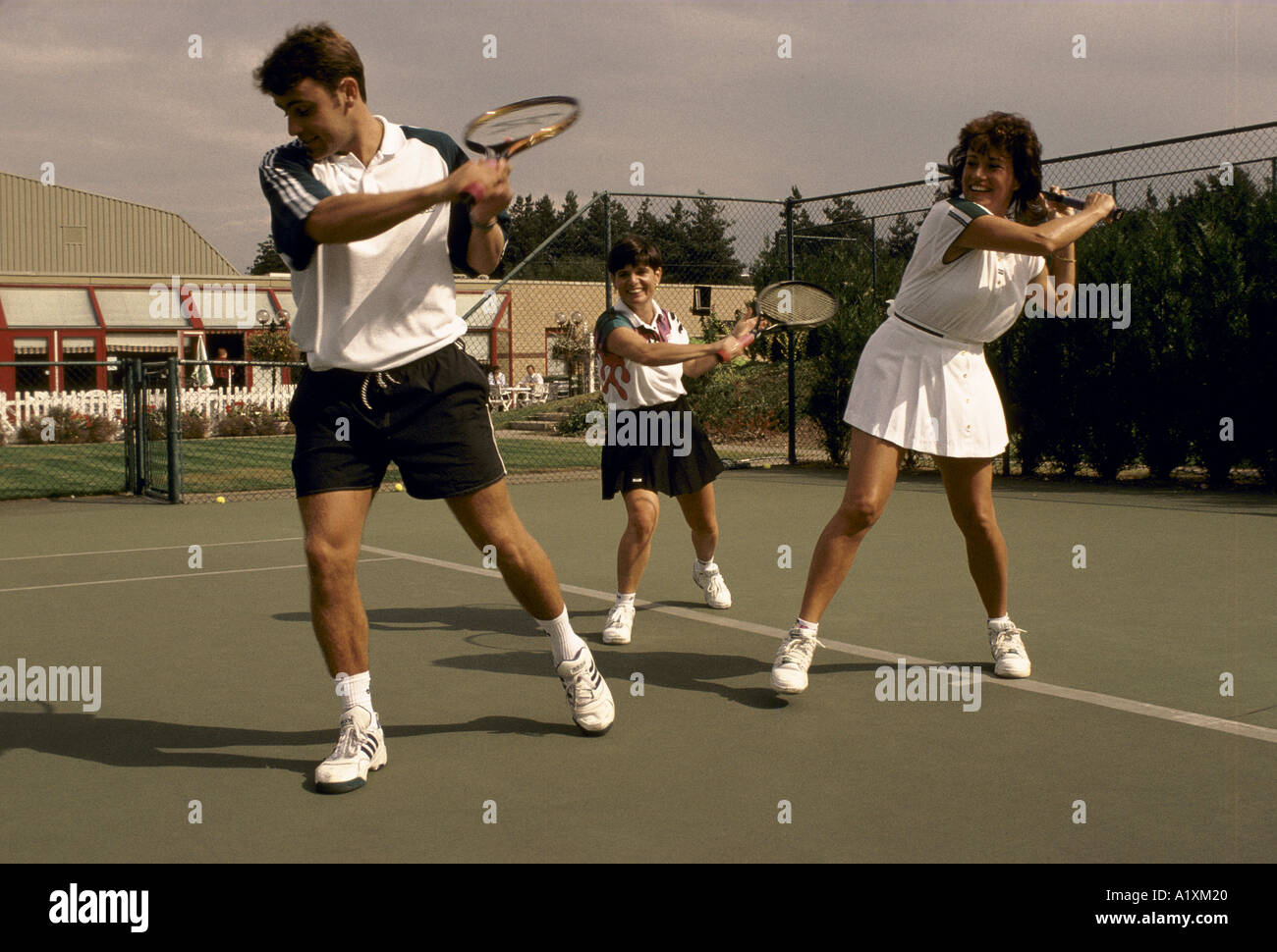 TENNIS LESSON IN PROGRESS Stock Photo - Alamy