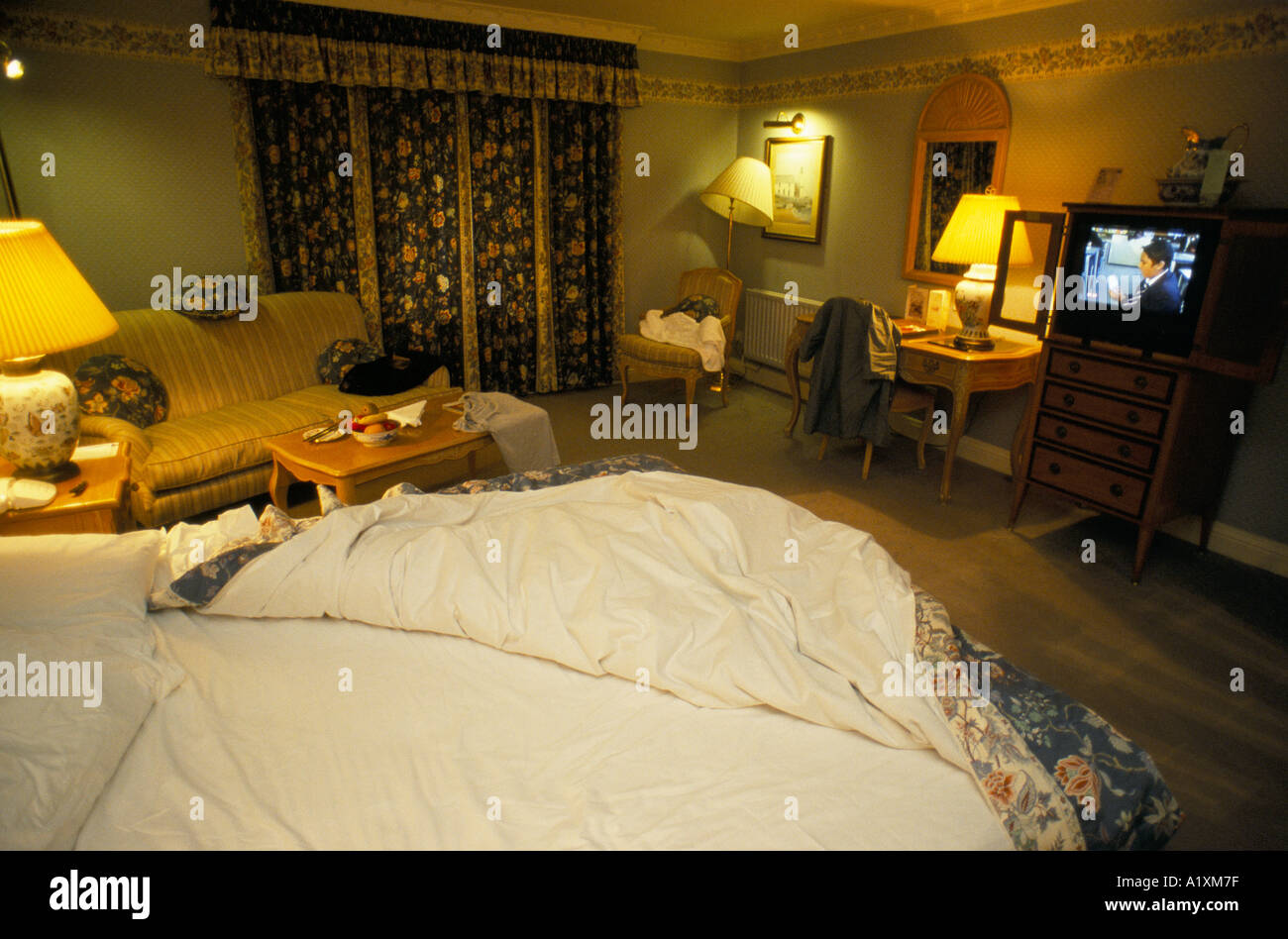 AN UNMADE BED IN A HOTEL ROOM Stock Photo - Alamy