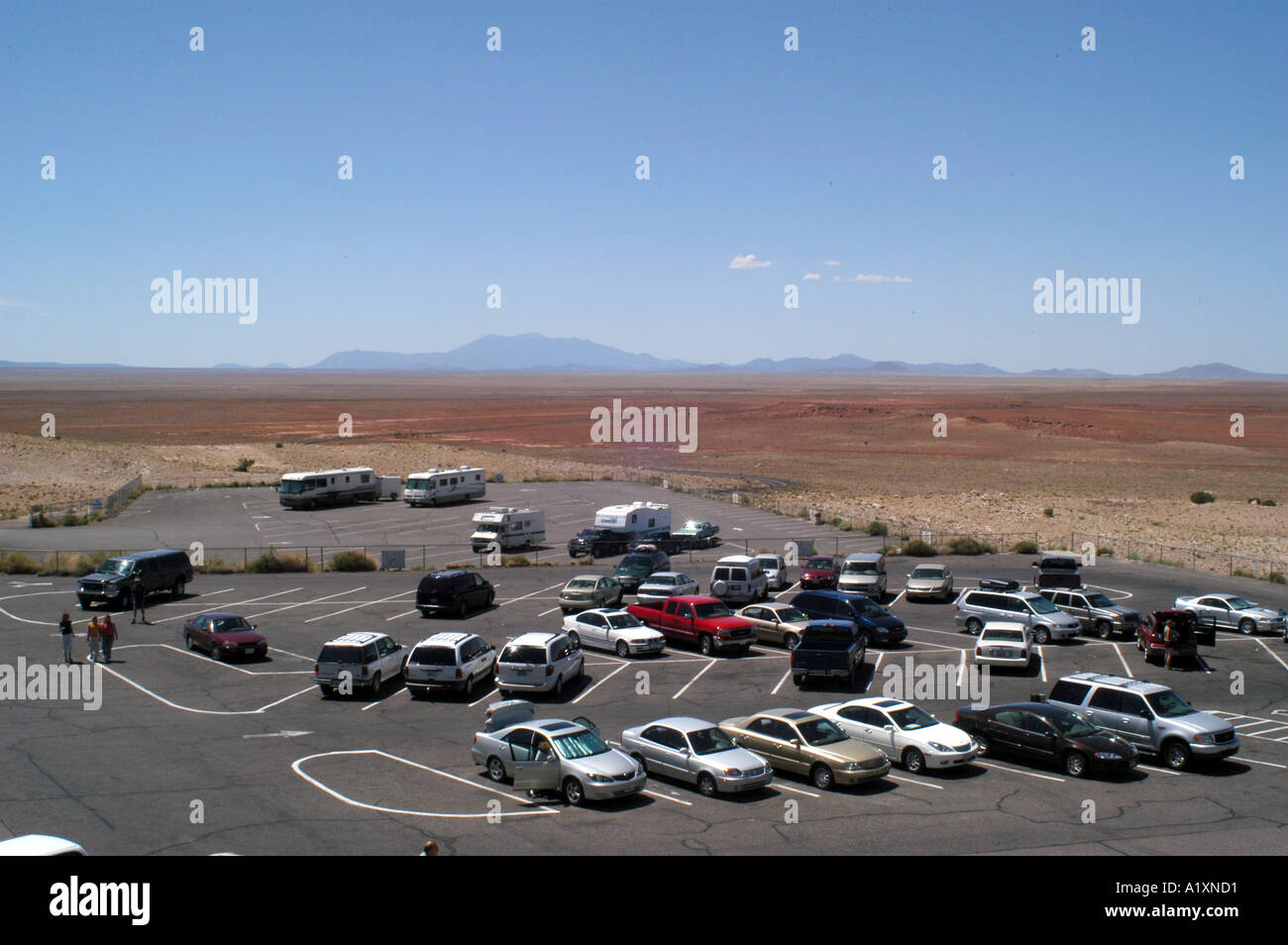 Cars of tourists on a car park in the desert Stock Photo - Alamy