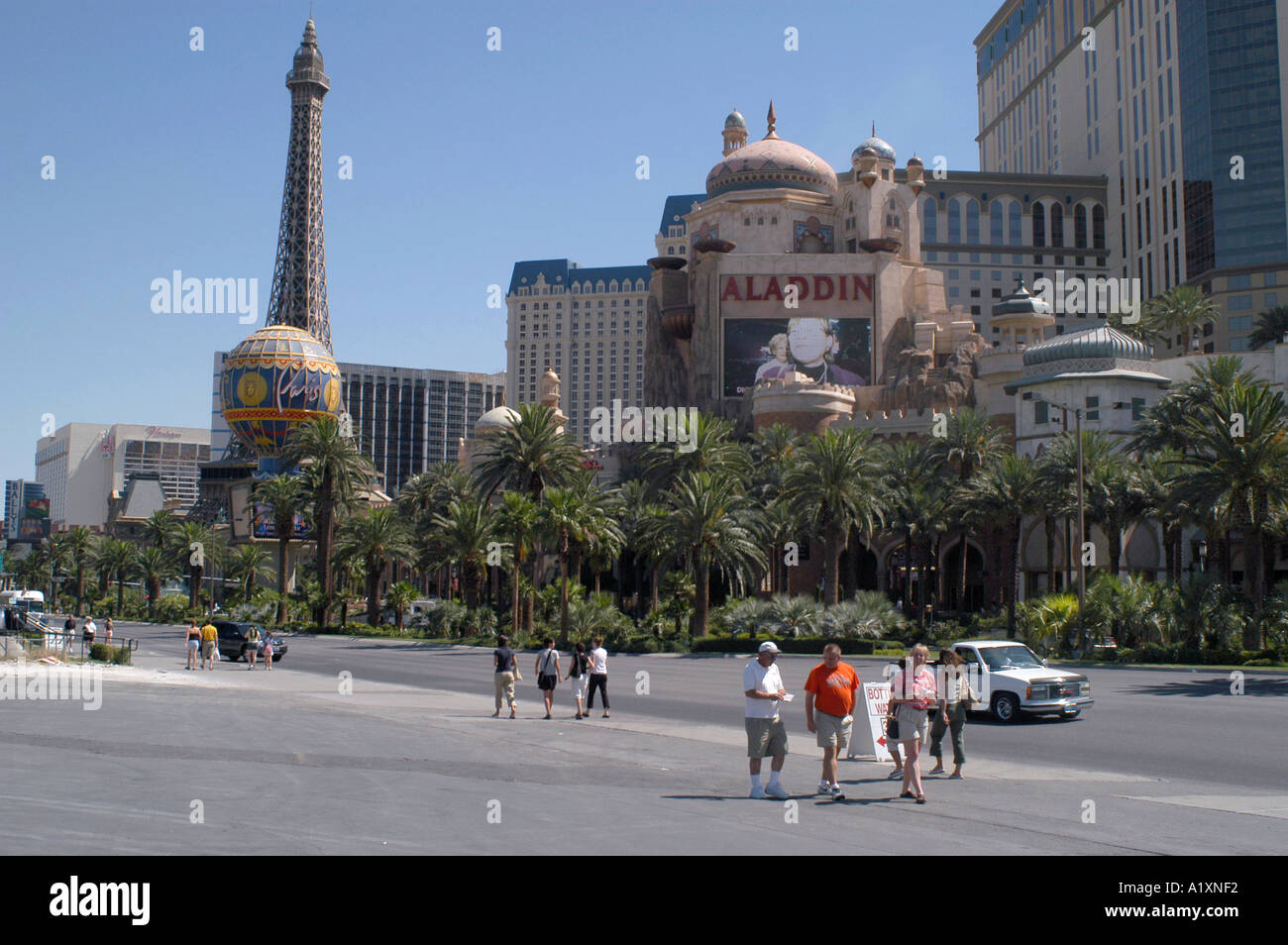 Tourists walking on The Strip Las Vegas Blvd past a replica Eiffel ...