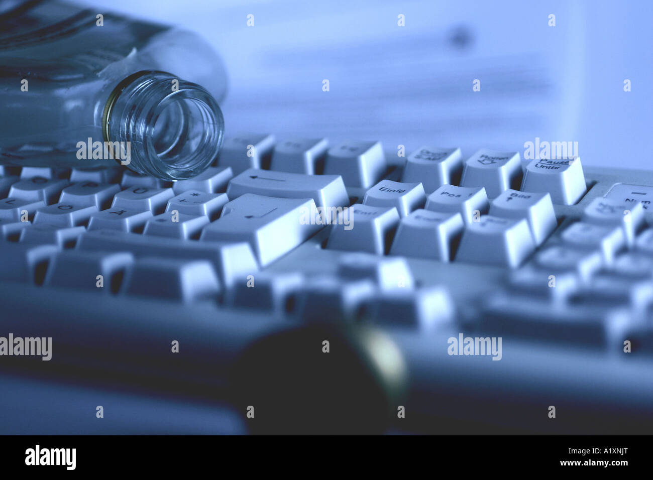 keyboard and an empty bottle Stock Photo - Alamy