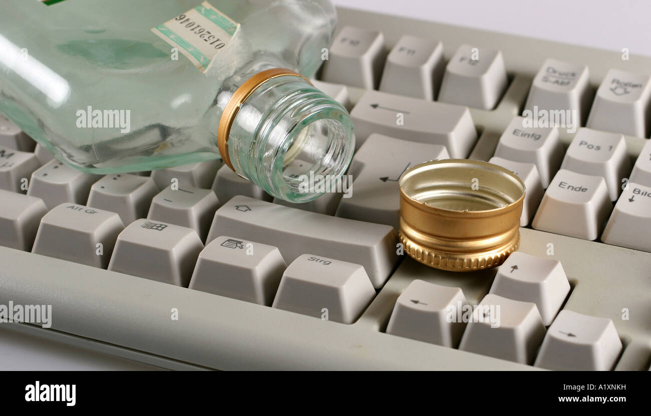 keyboard and an empty bottle Stock Photo - Alamy