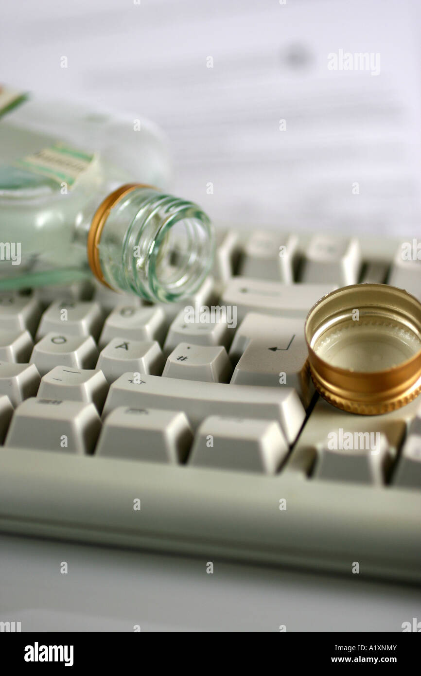 keyboard and an empty bottle Stock Photo - Alamy