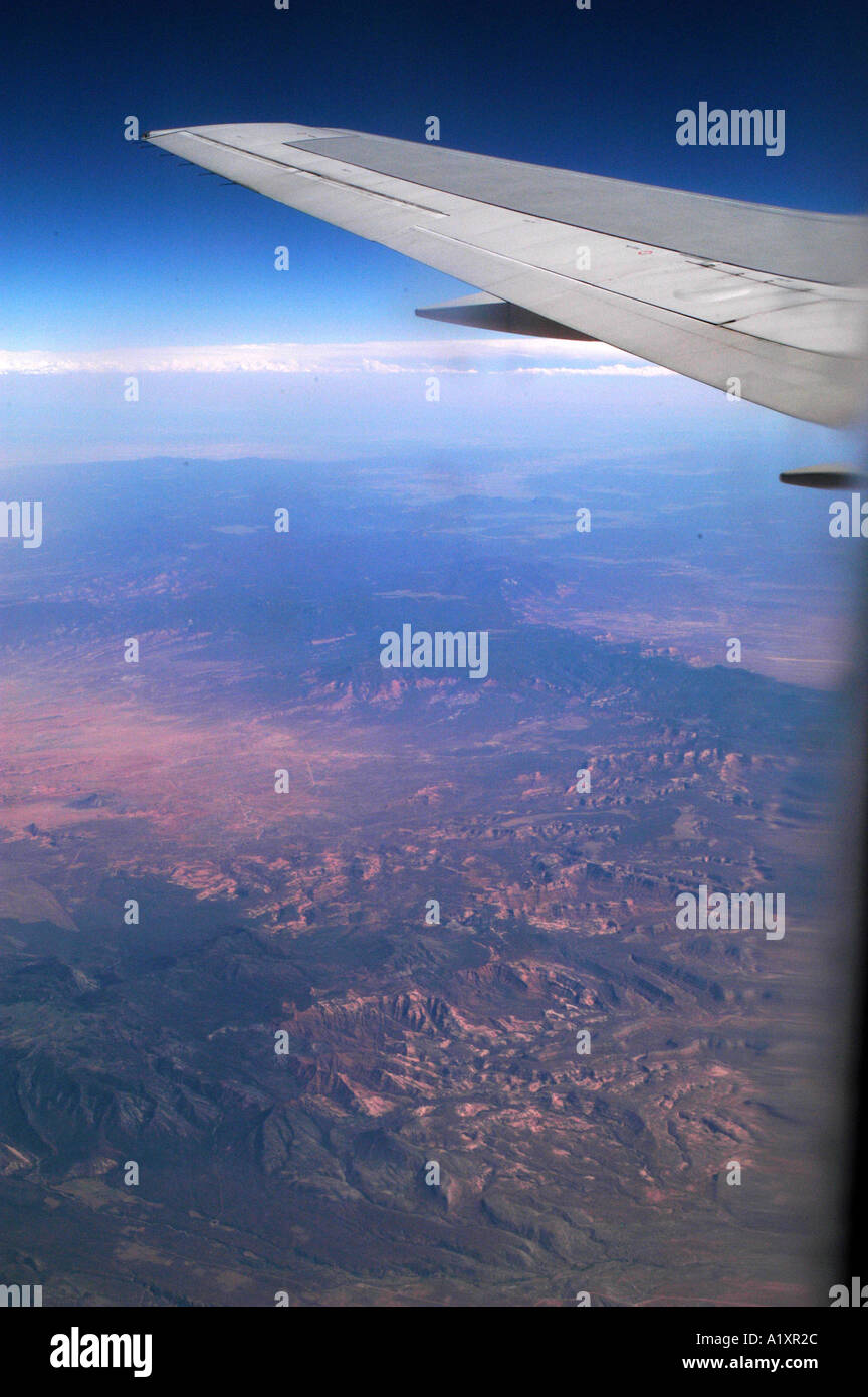 Aerial photograph from the window of passenger jet of canyon topography ...