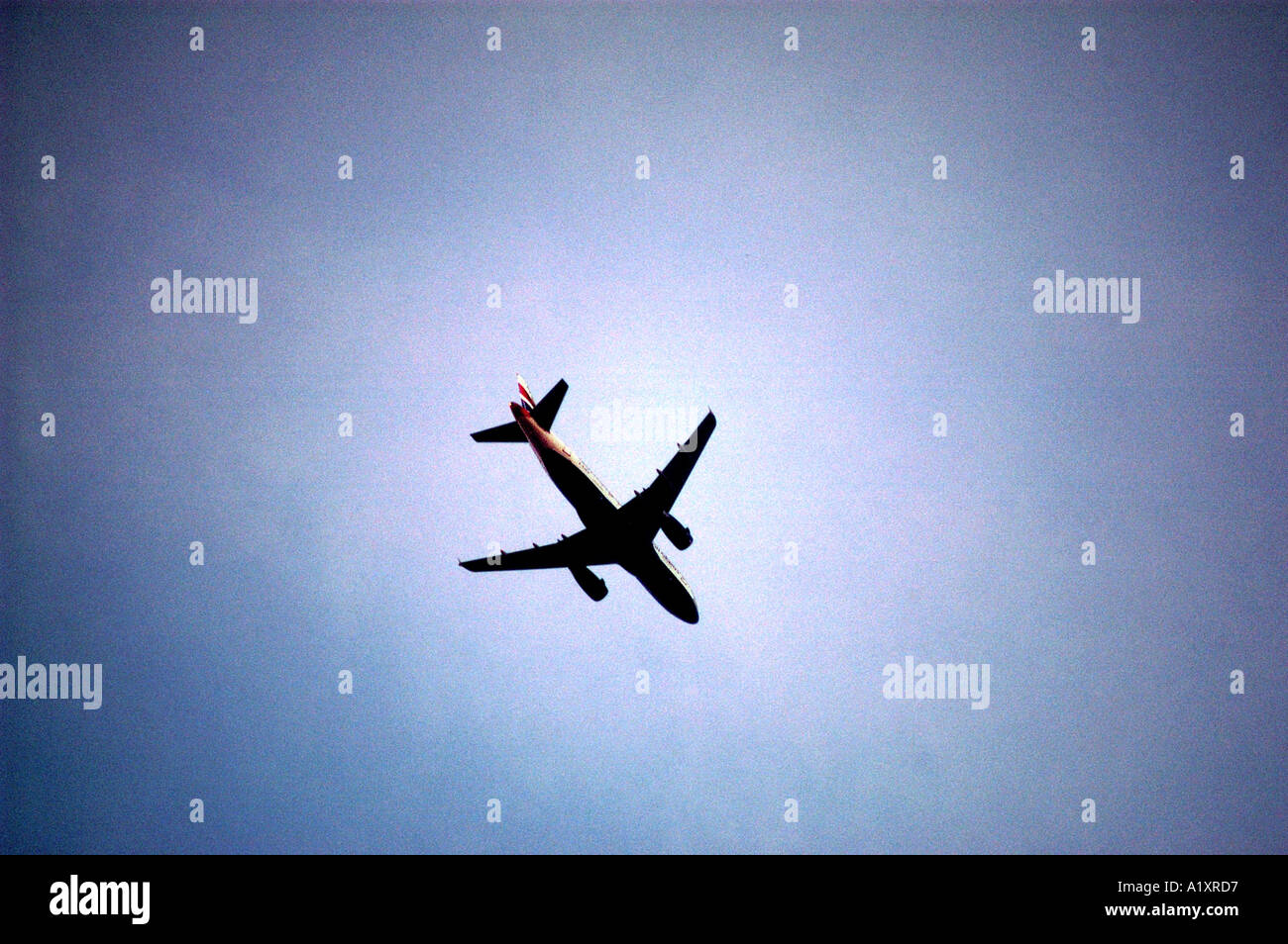 Distant passenger jet plane flying hi-res stock photography and images ...