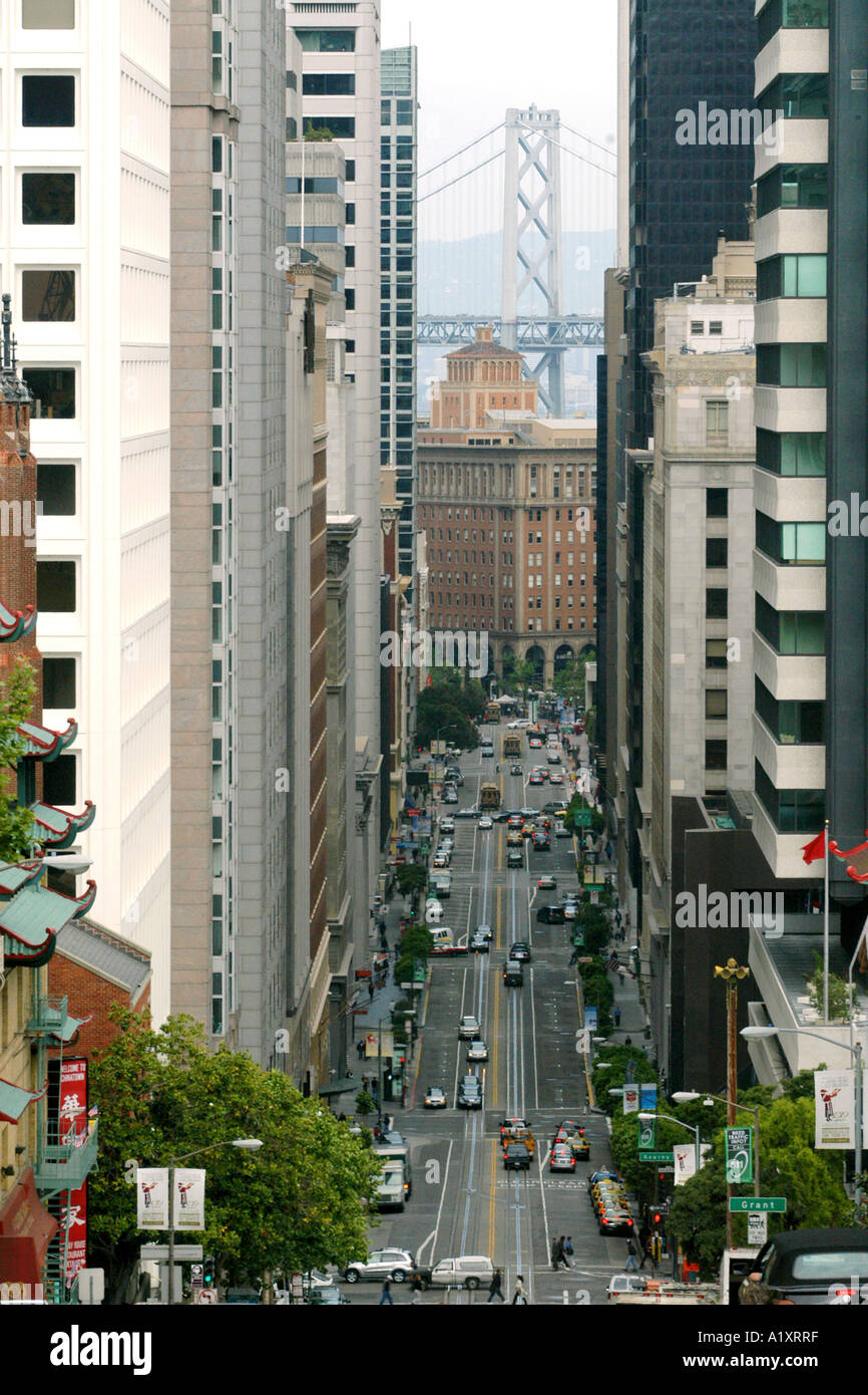 San Francisco California USA looking down steep street with Bay Bridge ...