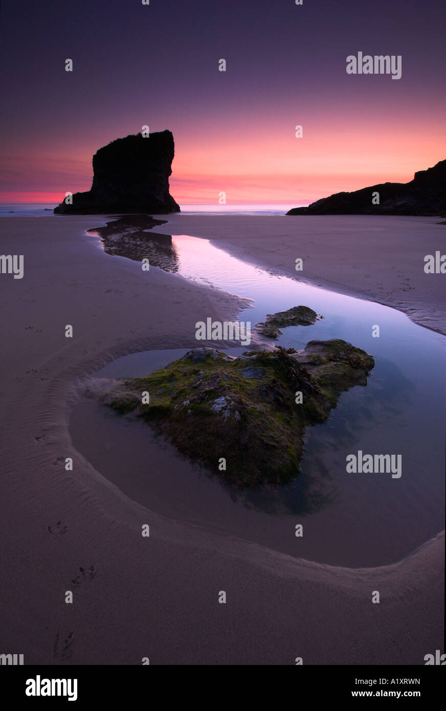 Rockpool and channel connects this dark rock to the huge stack in the ...