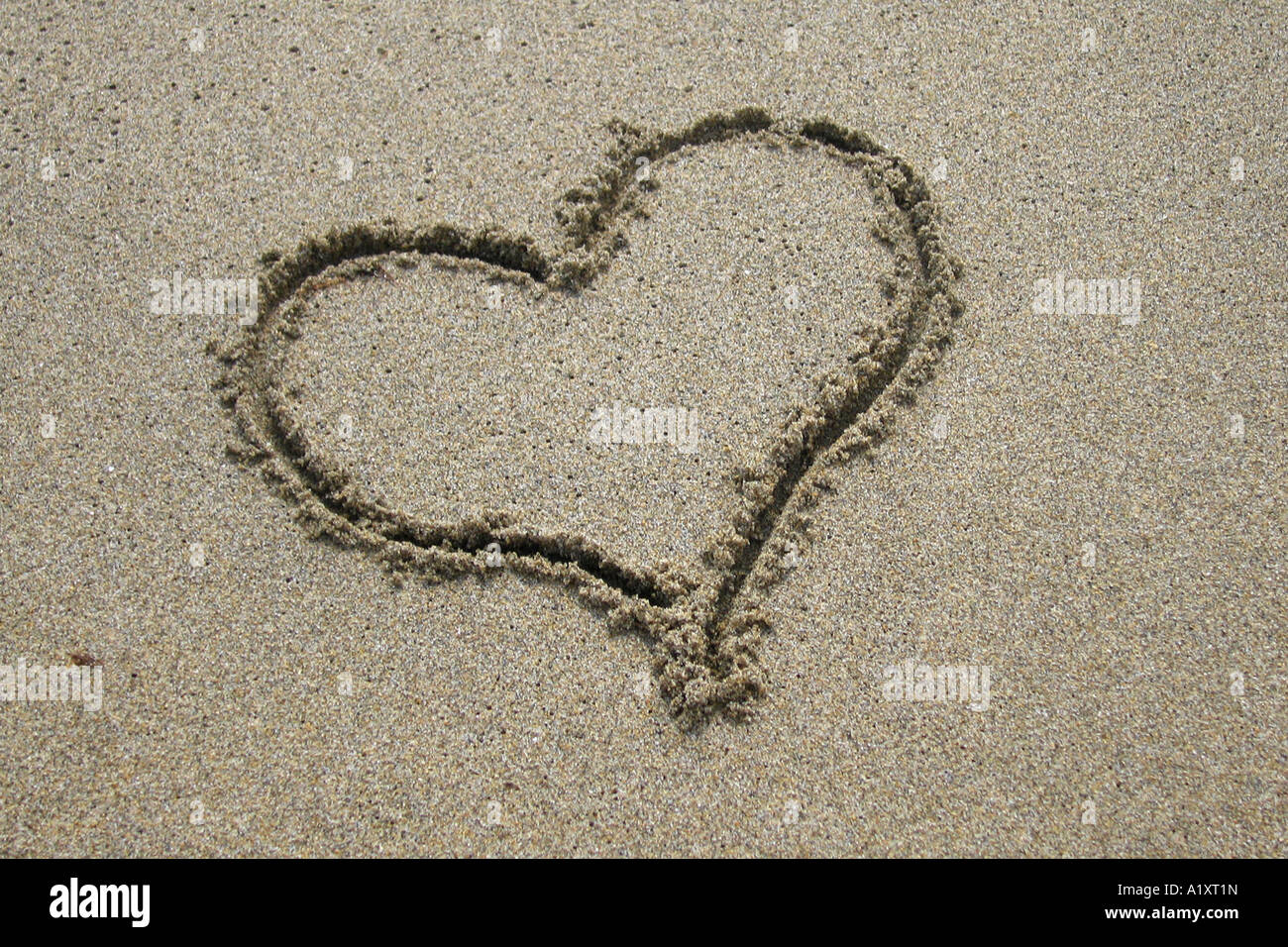 heart in the sand Stock Photo - Alamy