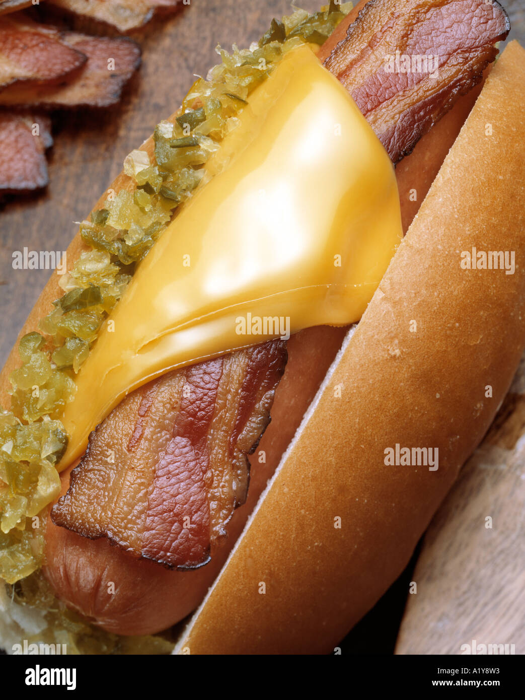 close up hot dog bacon melt melted cheese relish roll bun fast food ...