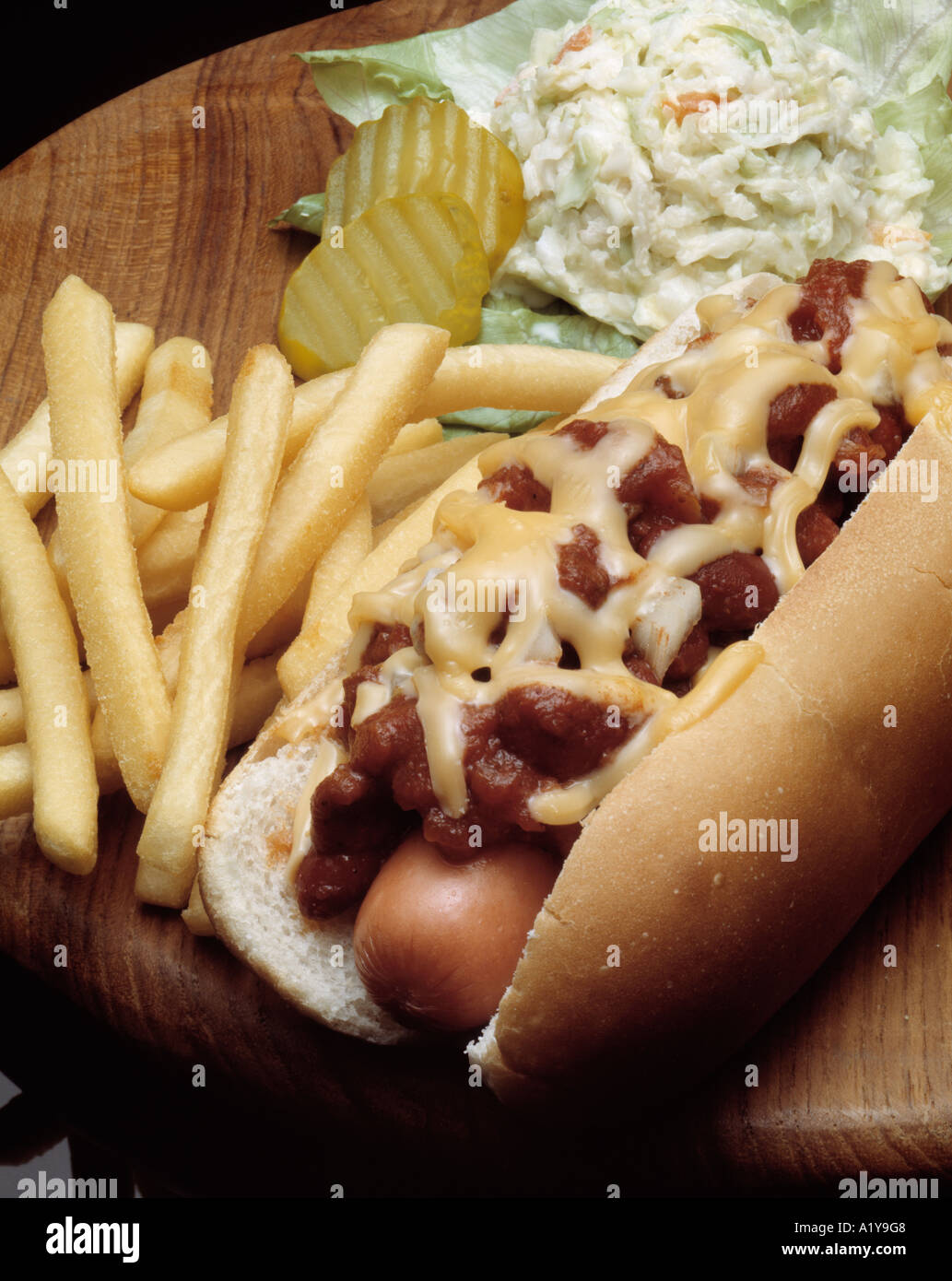 close up hot dog chili con carne cheese onions cole slaw pickle french ...