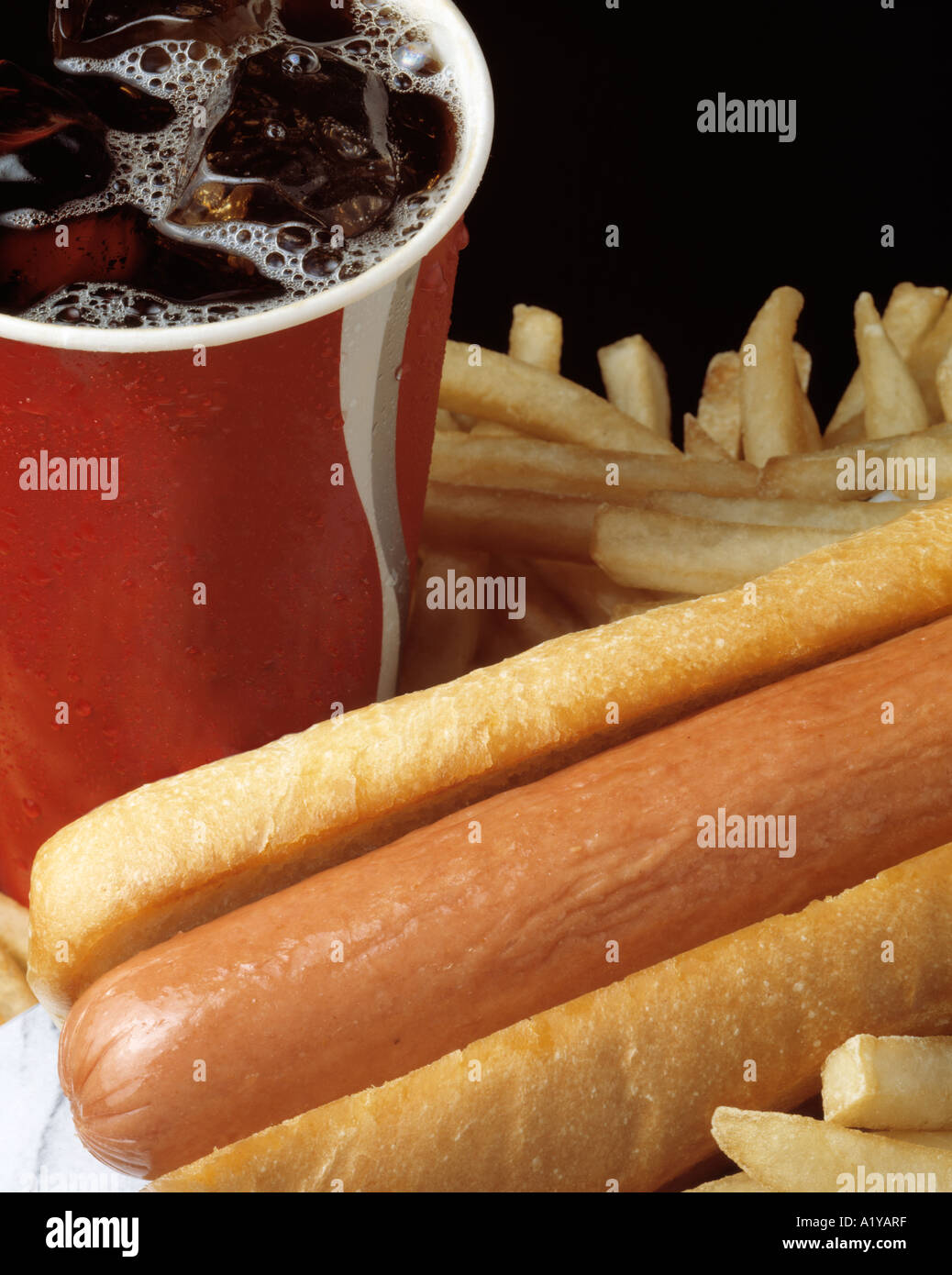 close up hot dog roll french fry fries chips red cup glass cola ice ...