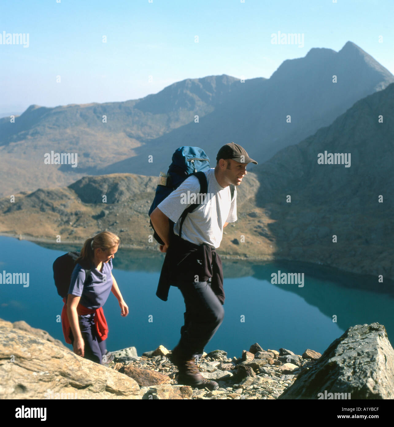 Couple hiking together walking up Mount Snowdon on the Pyg track in ...