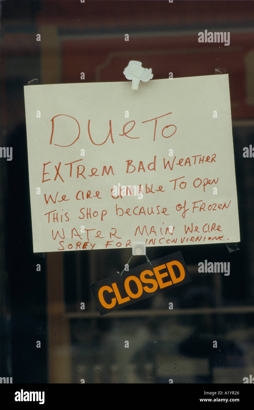 SIGN IN WINDOW OF SHOP EXPLAINING THAT IT IS CLOSED BECAUSE OF A FROZEN ...
