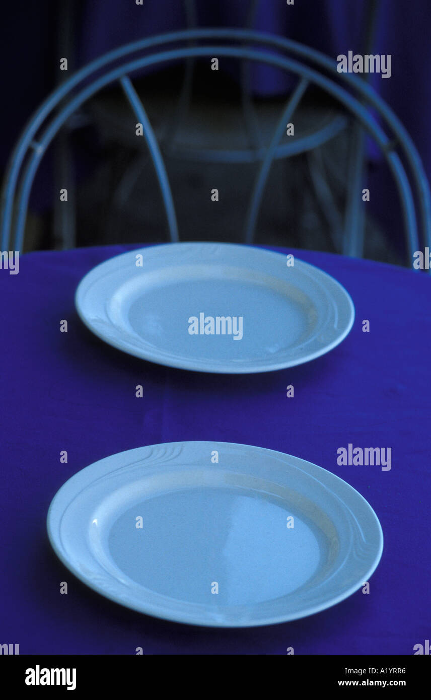 2 two blue plates on restaurant table Stock Photo - Alamy