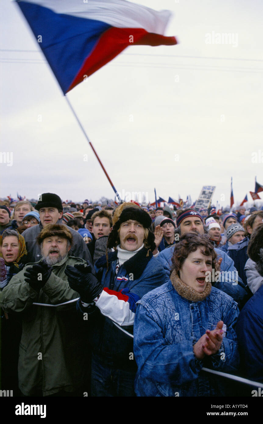 CROWD OF PEOPLE SHOUTING CLAPPING WAVING NATIONAL FLAGS IN PRAGUE ...