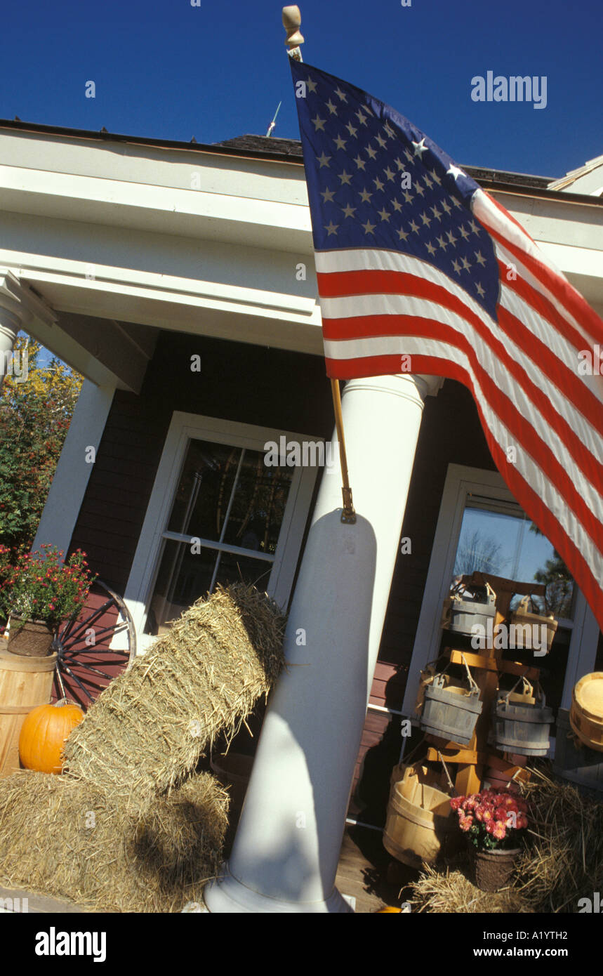 general store front porch pumpkins american flag Stock Photo - Alamy