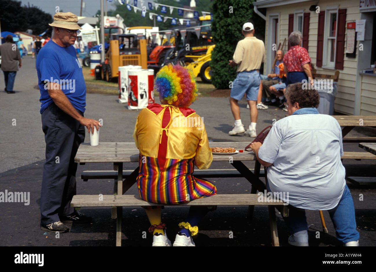 clown on coffee break at country county fair Stock Photo - Alamy