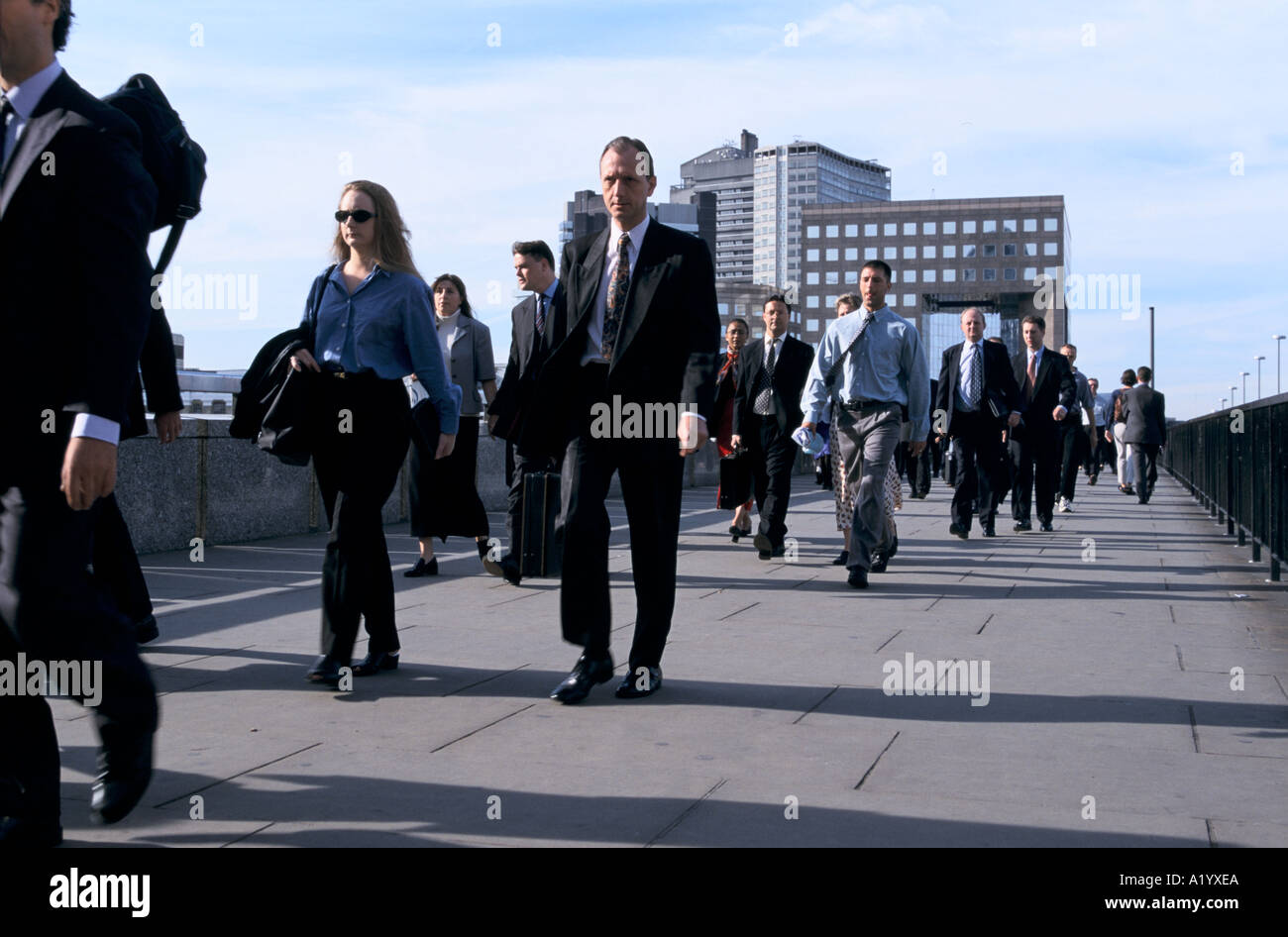 CITY OF LONDON COMMUTERS WALKING OVER LONDON BRIDGE FROM SOUTH OF THE ...
