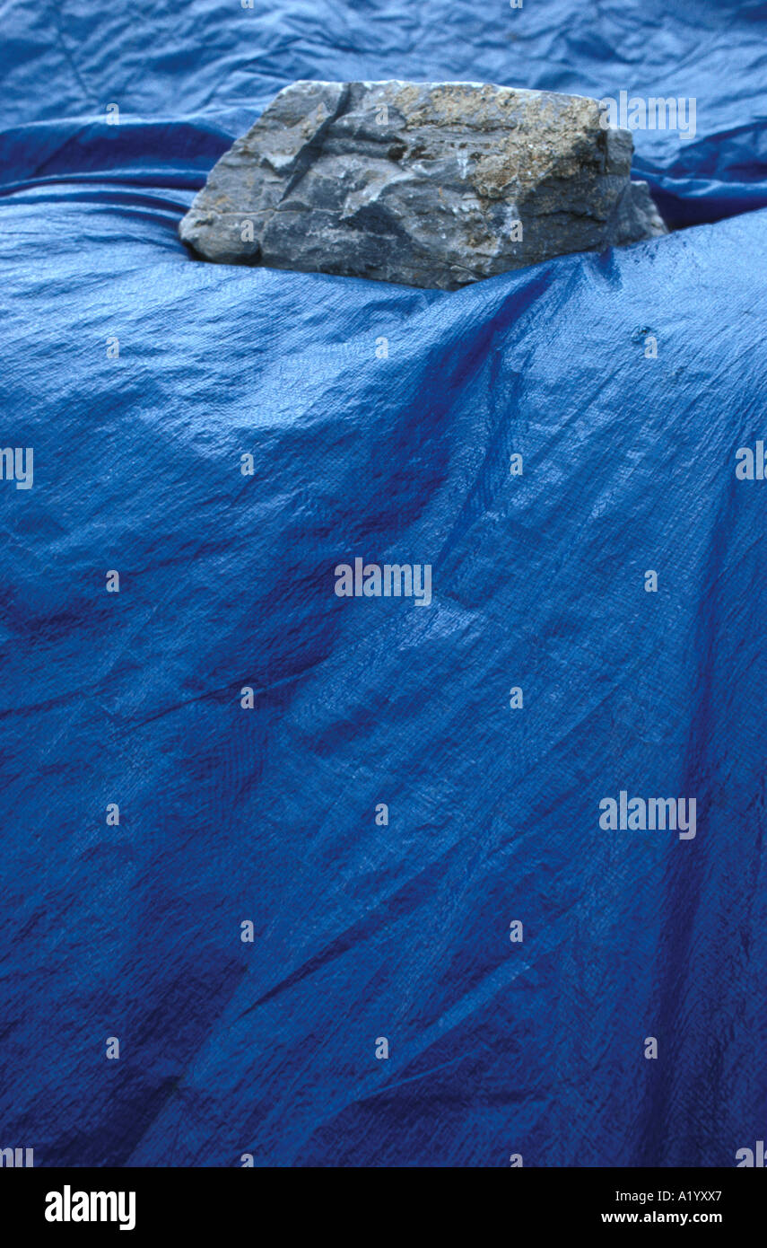 blue vinyl tarp rock Stock Photo - Alamy