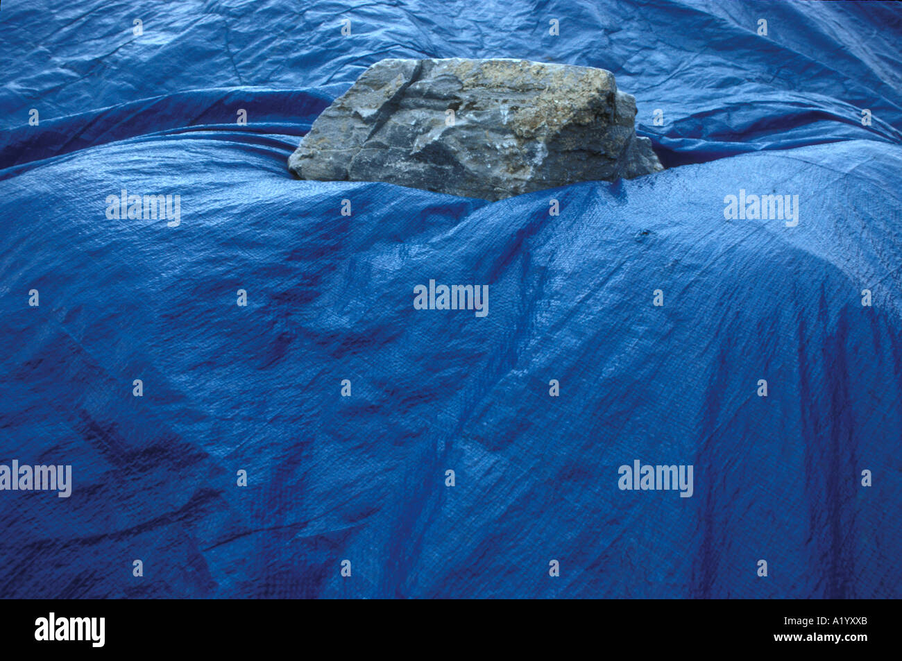 blue vinyl tarp rock Stock Photo - Alamy