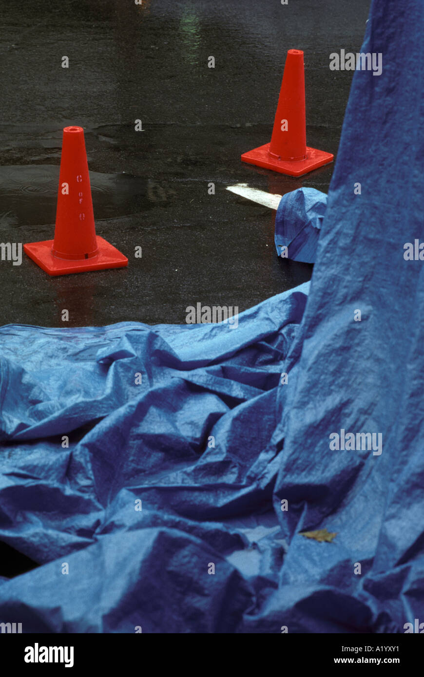 orange traffic cones blue vinyl tarp Stock Photo - Alamy