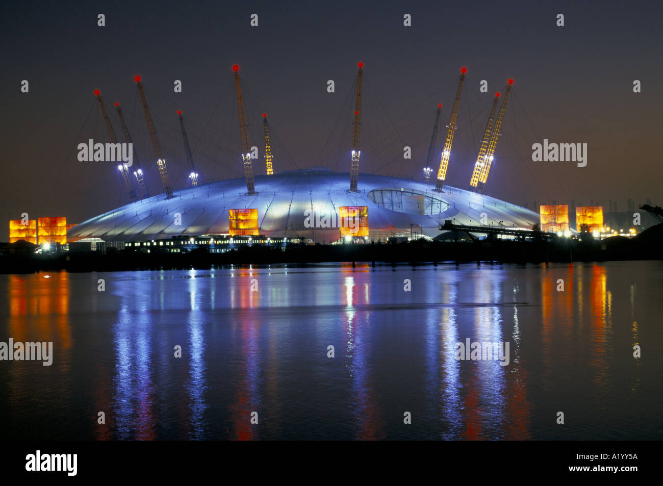 THE MILLENNIUM DOME AT NIGHT ILLUMINATED FROM WITHIN LIGHTS REFLECTED ...