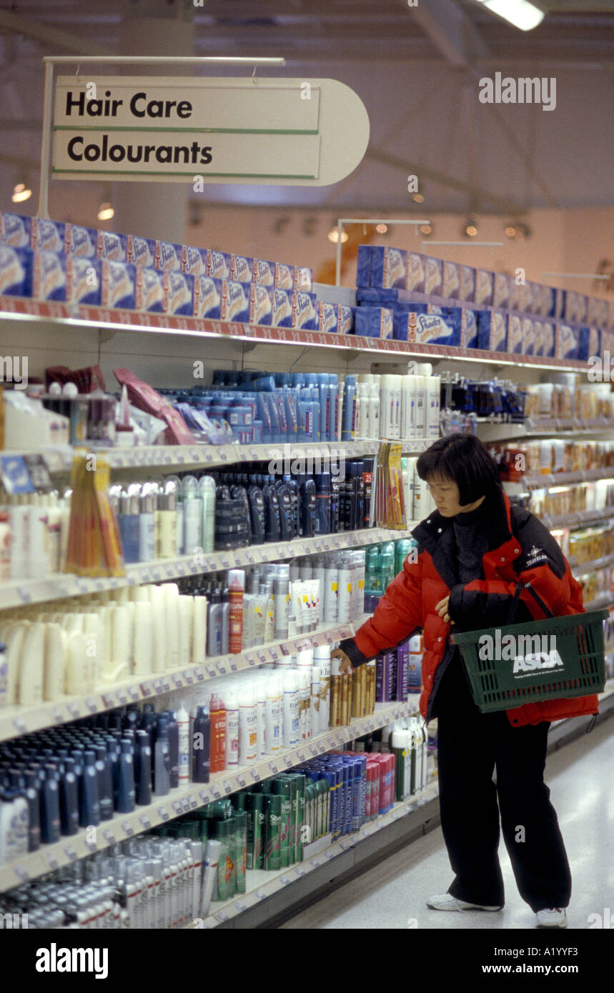CUSTOMER CHOOSES HAIR PRODUCTS ASDA WEMBLEY 1999 Stock Photo - Alamy