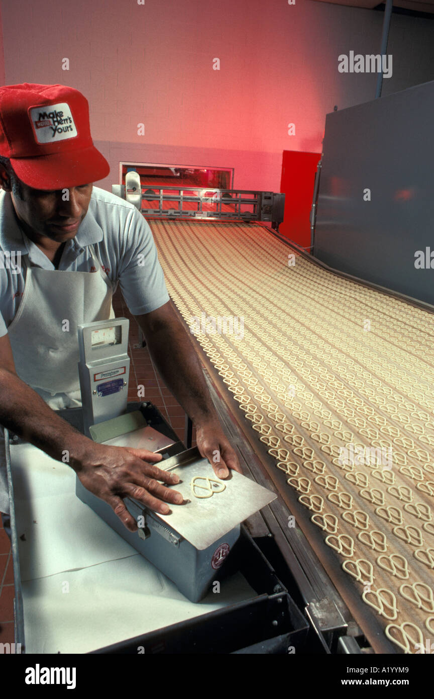 production line fast food pretzel manufacturing checks for weight ...