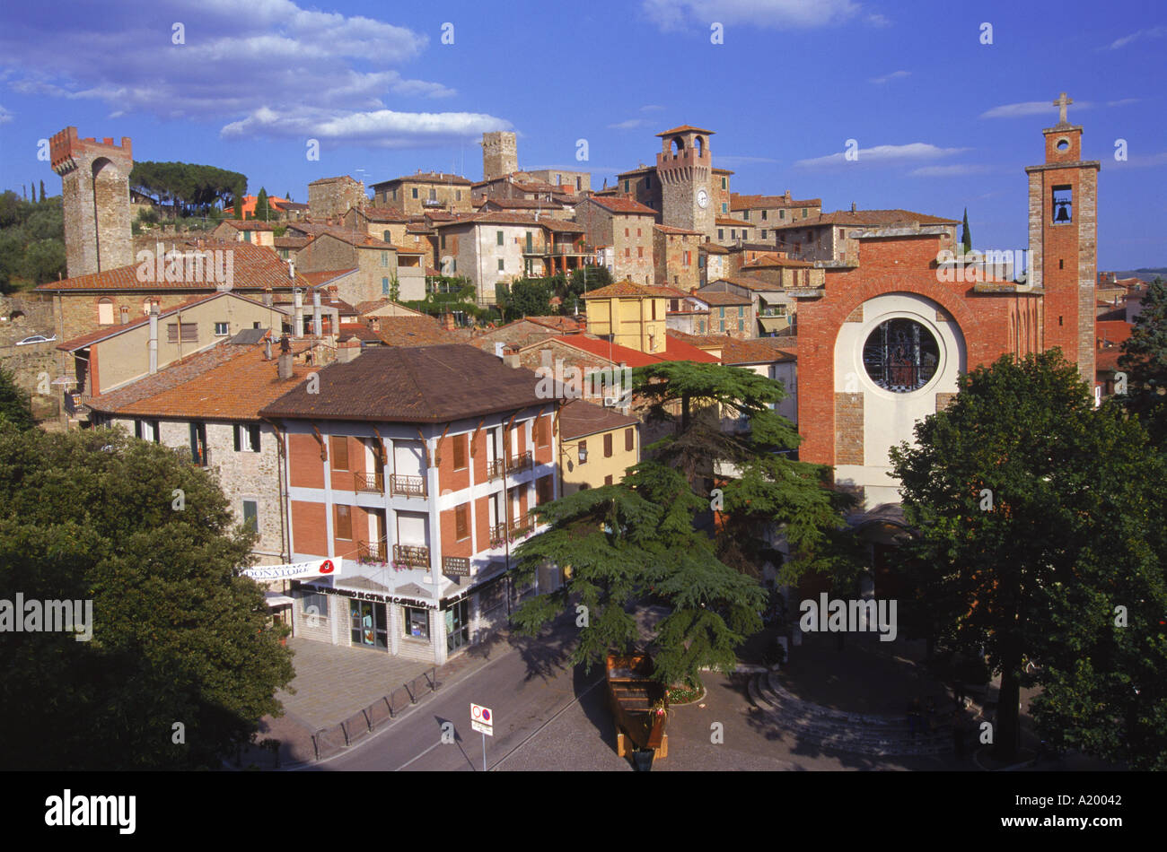 Houses churches and towers in the town of Passignano on Lake Trasimene ...