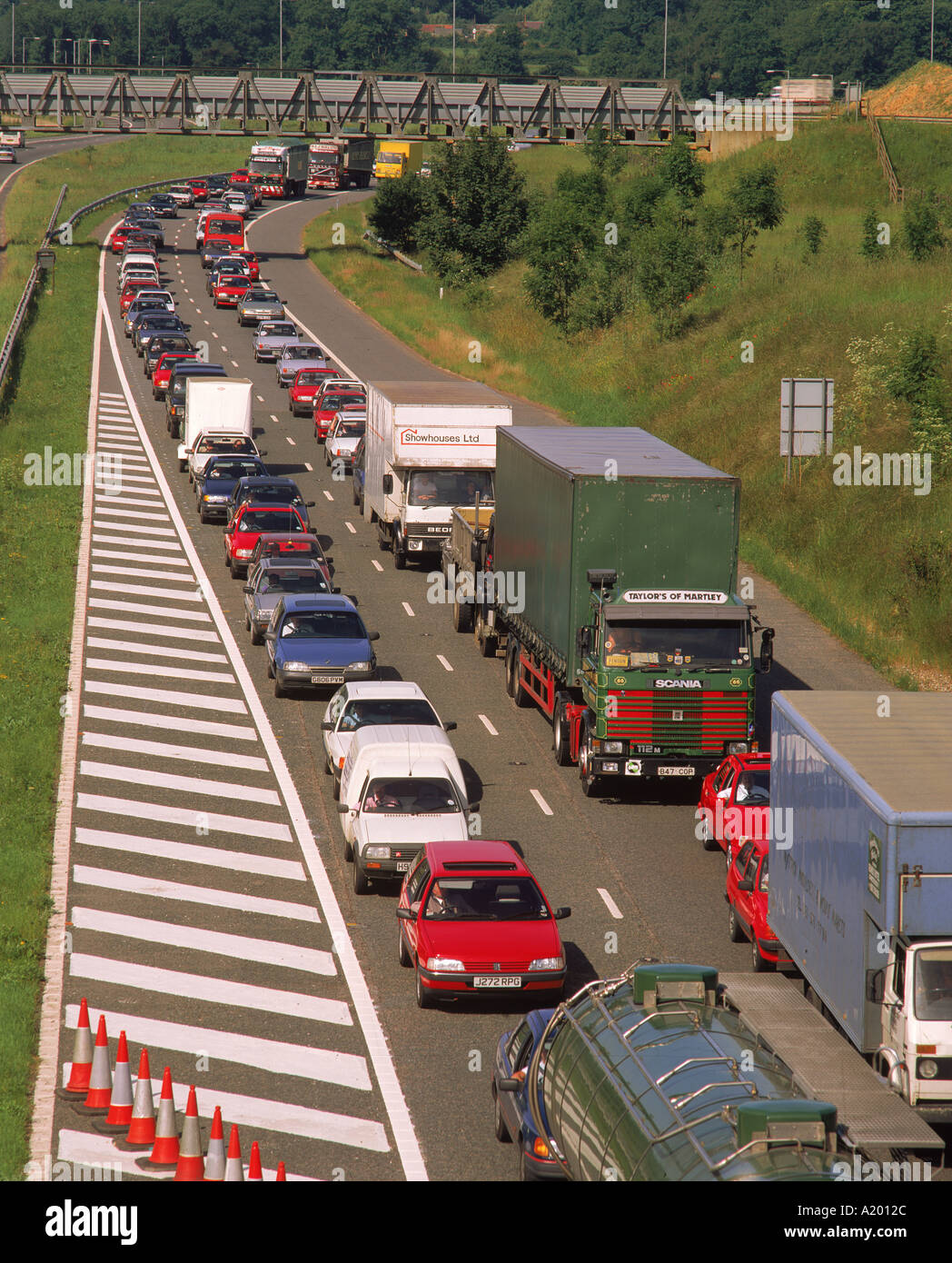 Lorries vans and cars in a traffic jam on a road in England G R ...