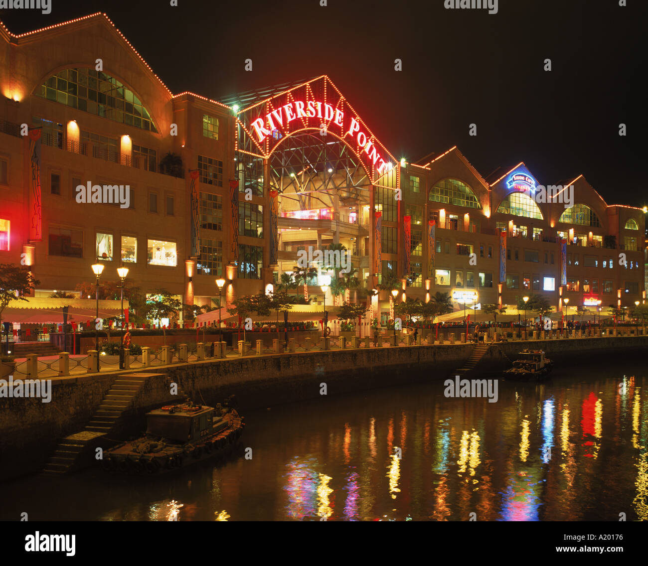 The lights of the waterfront complex of Riverside Point reflected in ...