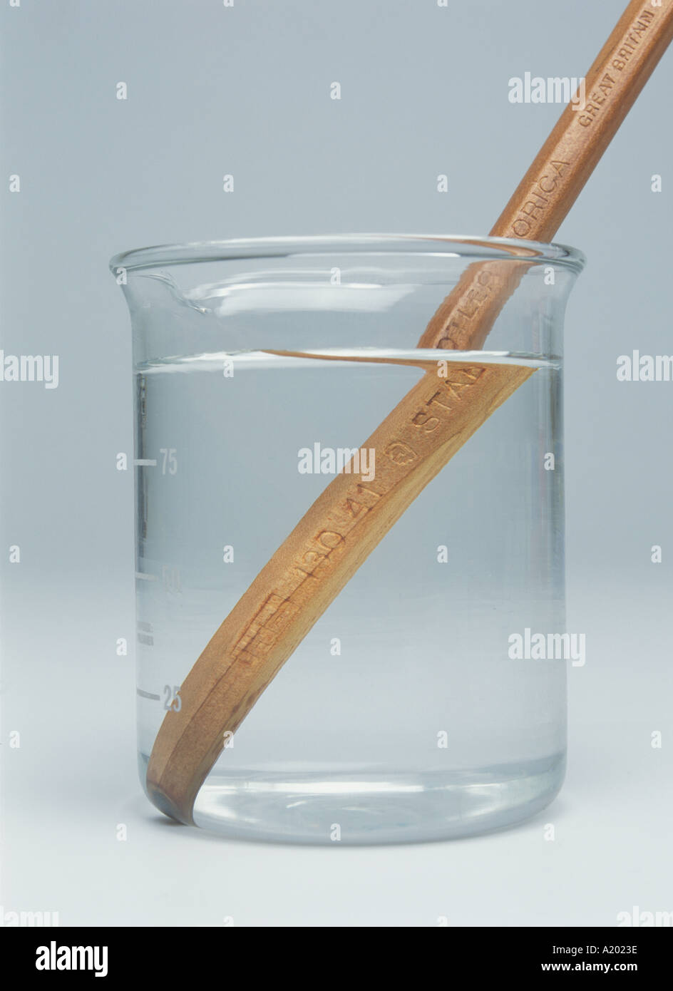 pencil appears bent in water due to refraction Stock Photo - Alamy