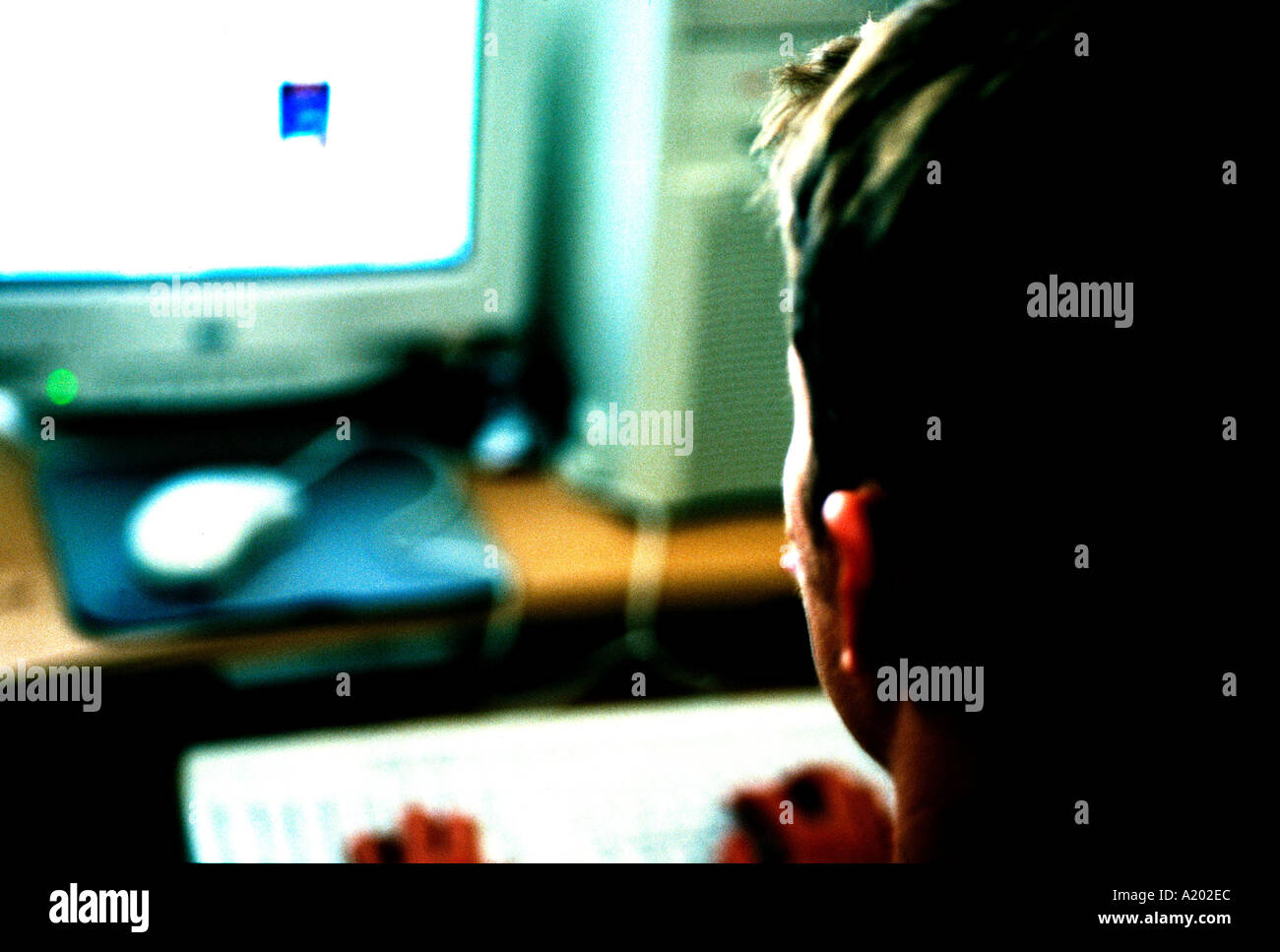 Adolescent Boy using Computer Stock Photo - Alamy